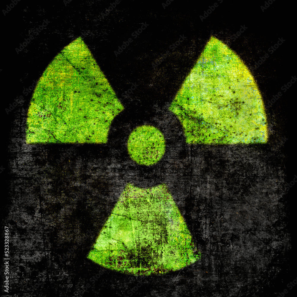 Radiation sign, green on black. Nuclear hazard emblem, grunge textured ...