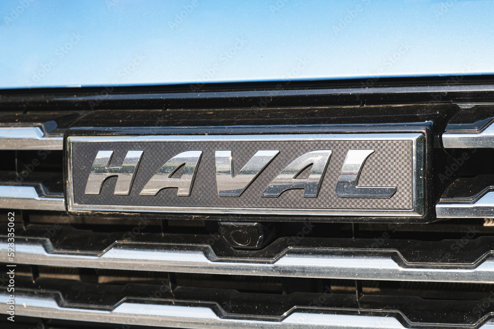 Mud-splattered Haval car logo close-up. Haval is a Chinese car brand ...