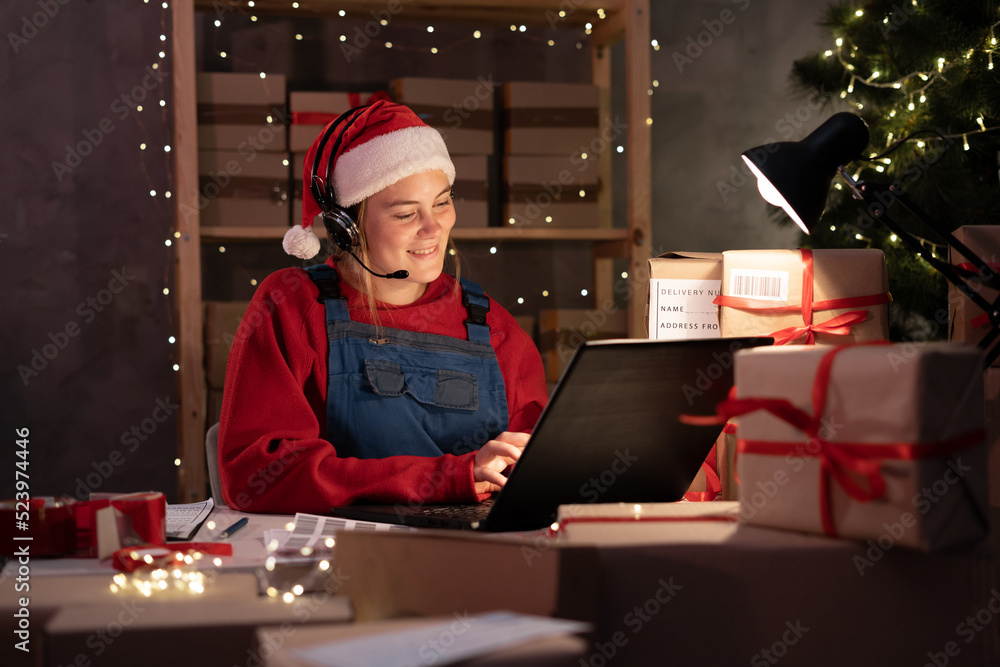 small business owner freelance santa working at home office using ...