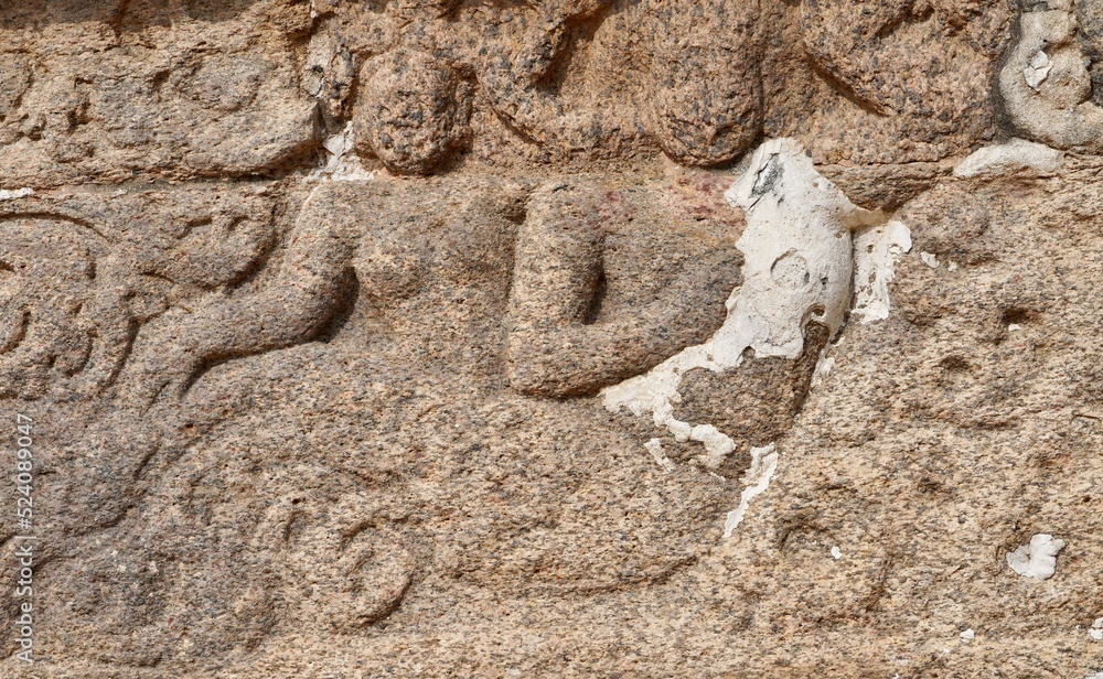 Bas relief rock cut sculptures of gods, people and animals are carved ...