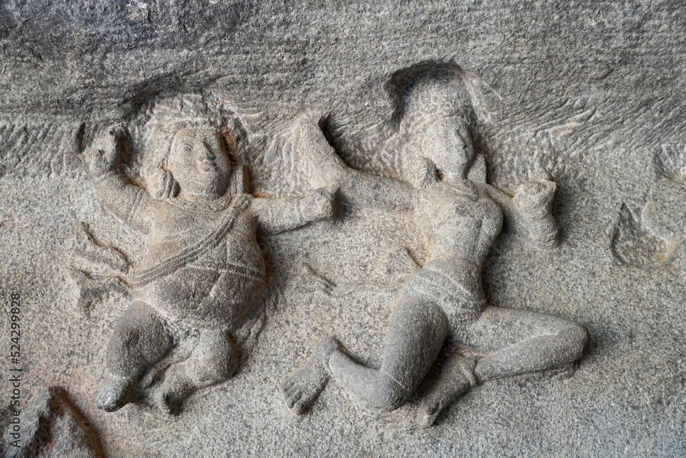 Bas relief rock cut sculptures of gods, people and animals are carved prominently in the ...