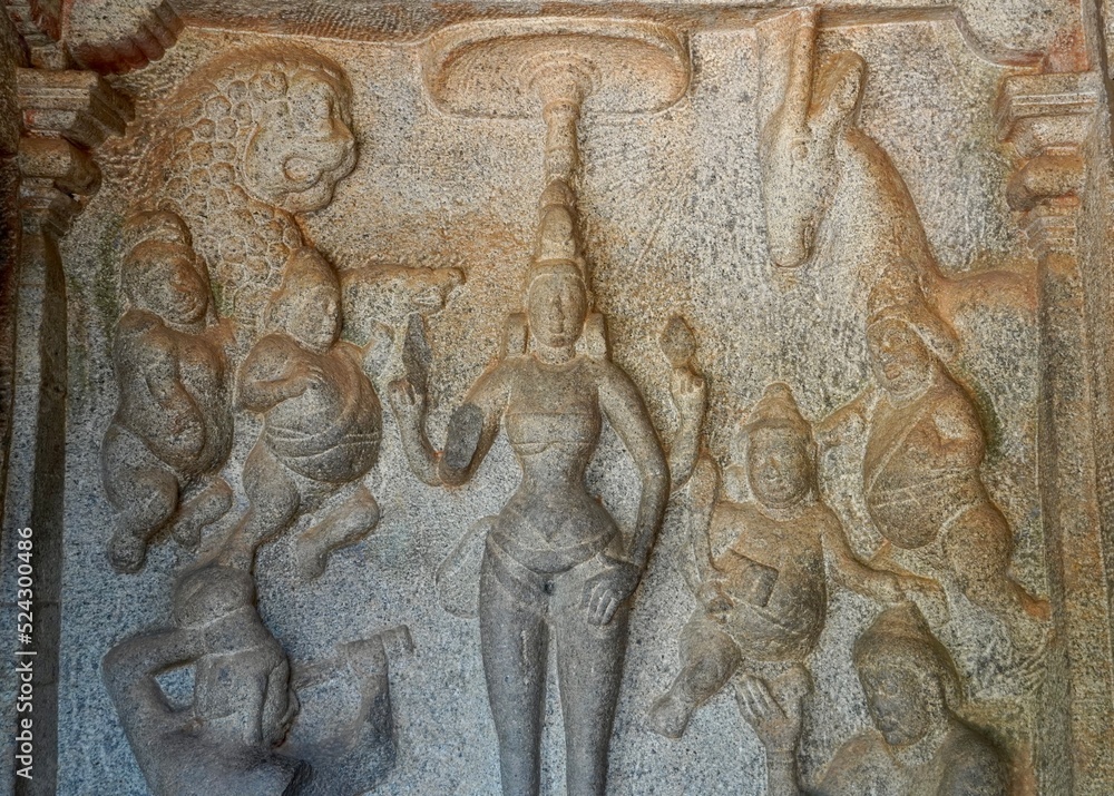Bas relief rock cut sculptures of gods, people and animals are carved prominently in the ...