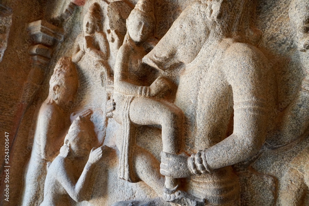 Bas relief rock cut sculptures of gods, people and animals are carved prominently in the ...