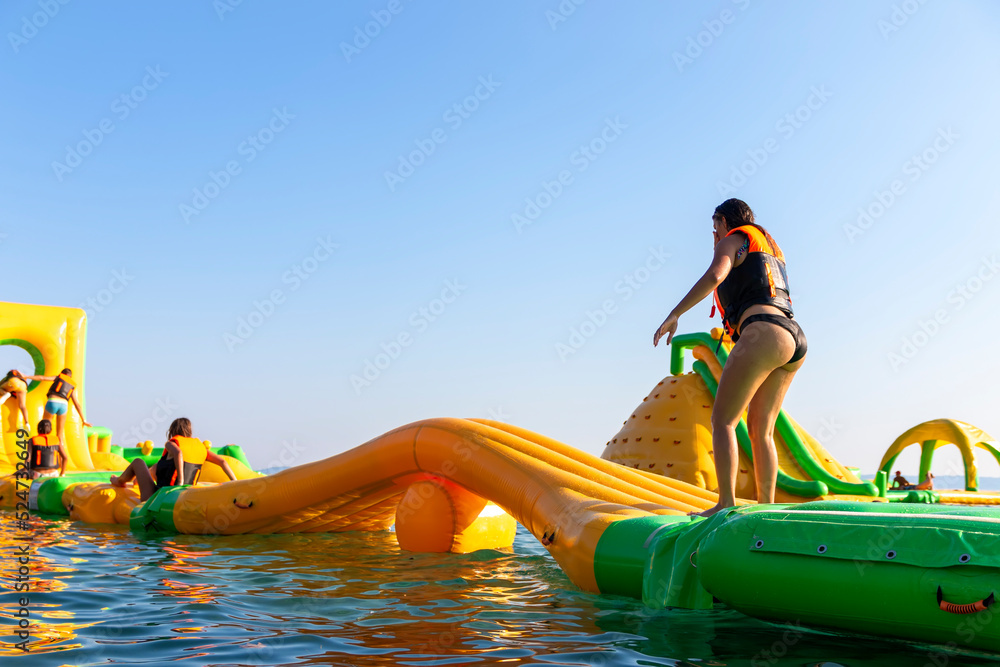Inflatable bounce castle floating in water.Aqua park for children ...