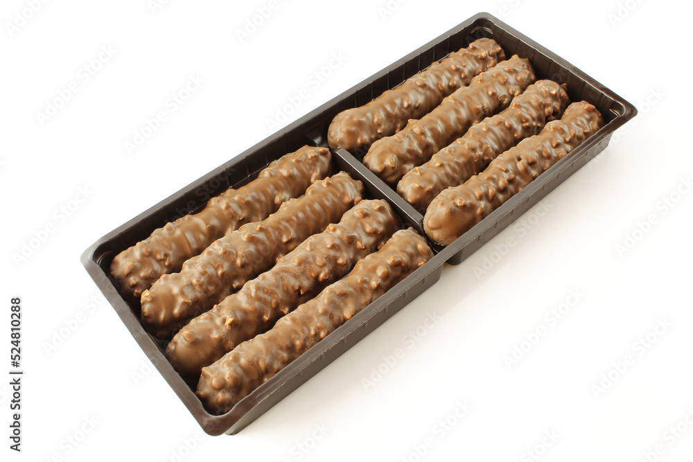Chocolate coated wafer sticks in plastic package isolated on white ...