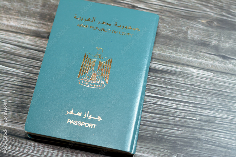 Egyptian passport isolated on wooden background, Arab republic of Egypt ...