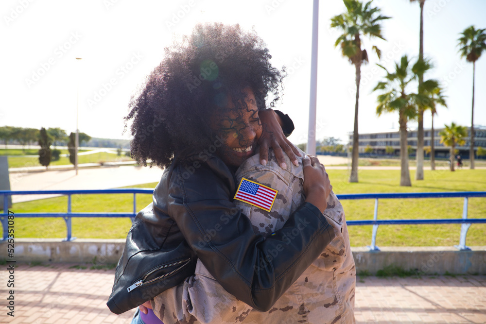 Afro-American woman and American soldier who has just arrived from the ...