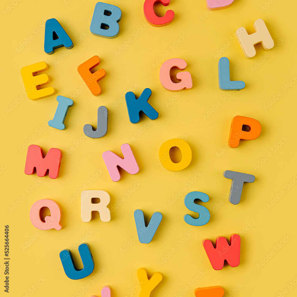 Colorful letters of the alphabet on yellow background. Primary school ...