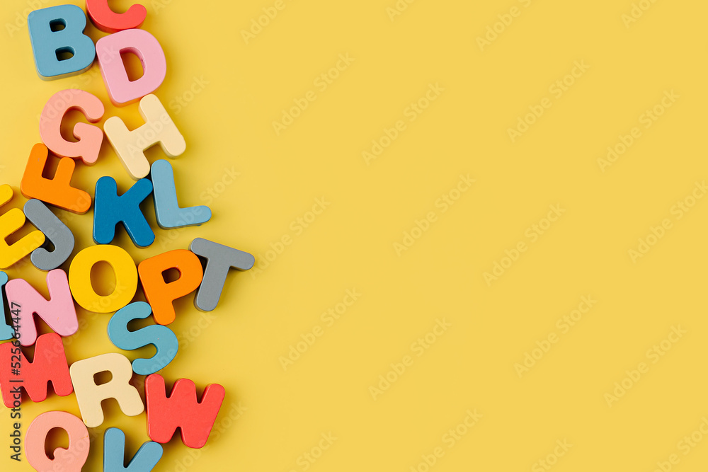 Colorful letters of the alphabet on yellow background. Primary school ...