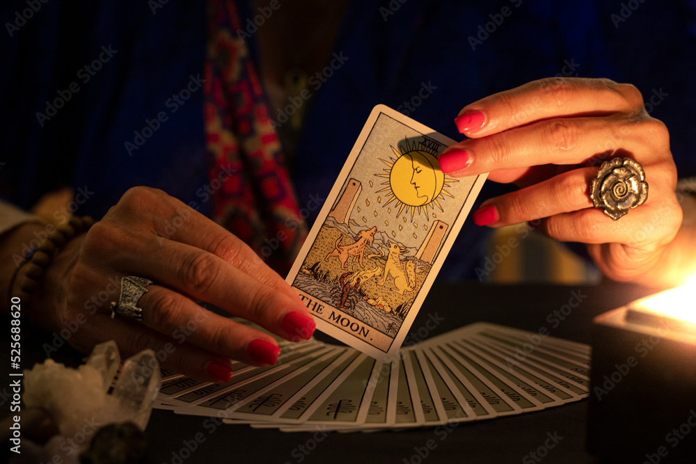 Fortune teller hands showing The Moon tarot card, symbol of intuition ...