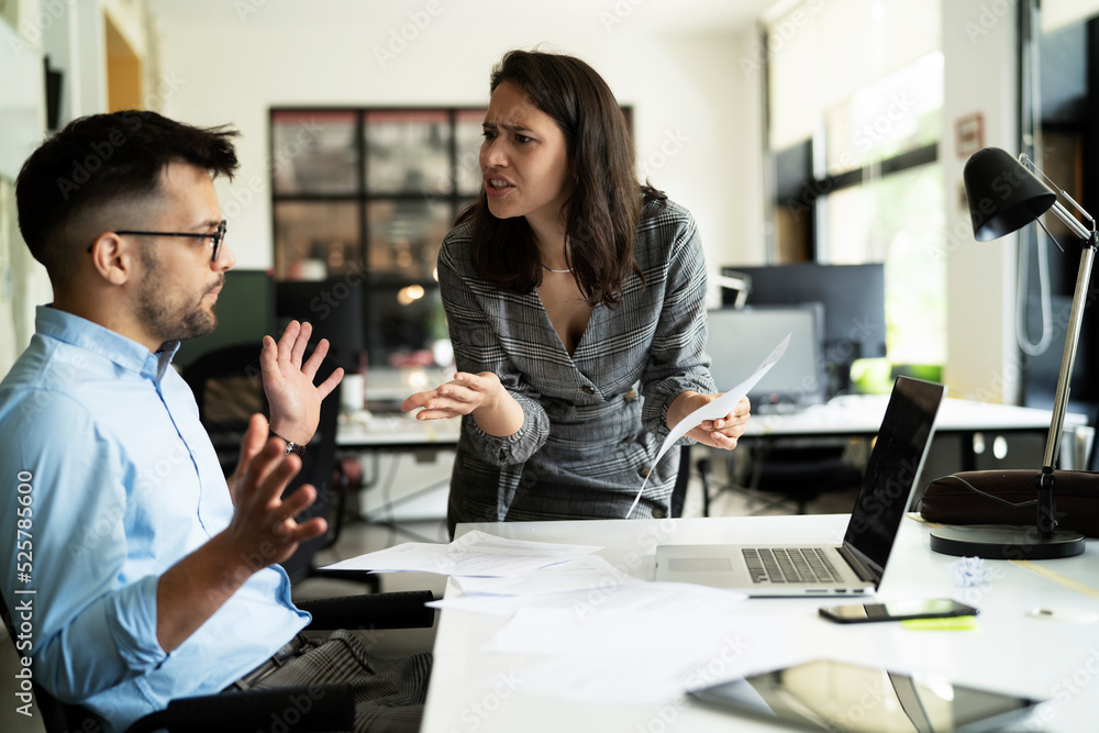 Colleagues arguing in office. Angry businesswoman yelling at her ...