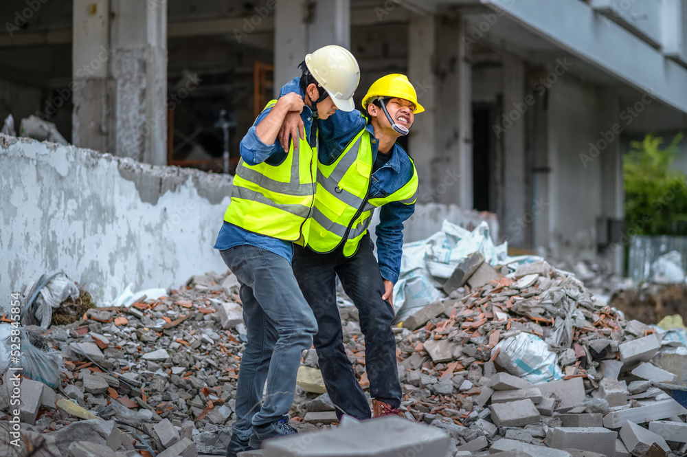 Construction supervisors or engineers help construction workers who ...