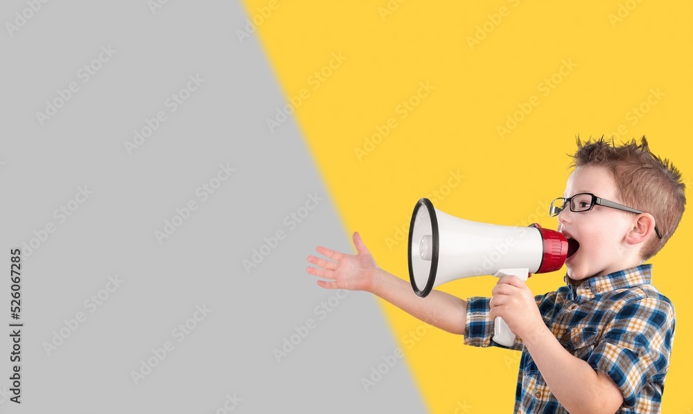 Portrait of young fun smart happy child hold megaphone loudspeaker back ...