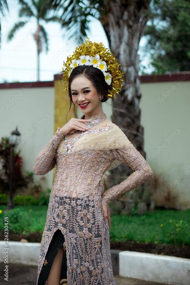 ภาพถ่าย Stock Beautiful Indonesian woman wearing KEBAYA. KEBAYA is a ...