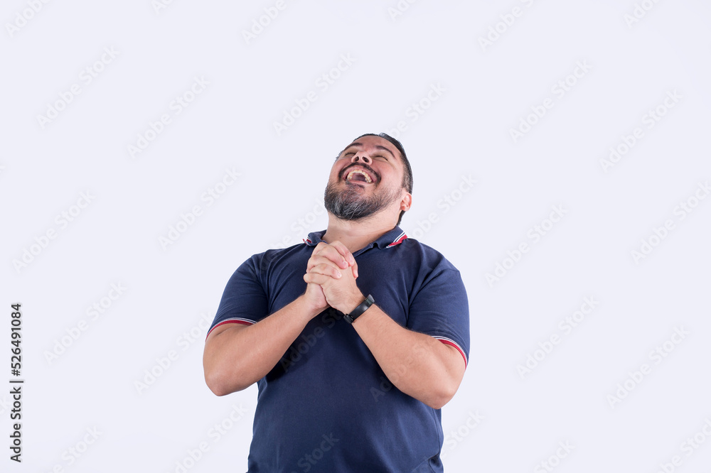 An emotional and elated man thanks a higher power for his successes ...