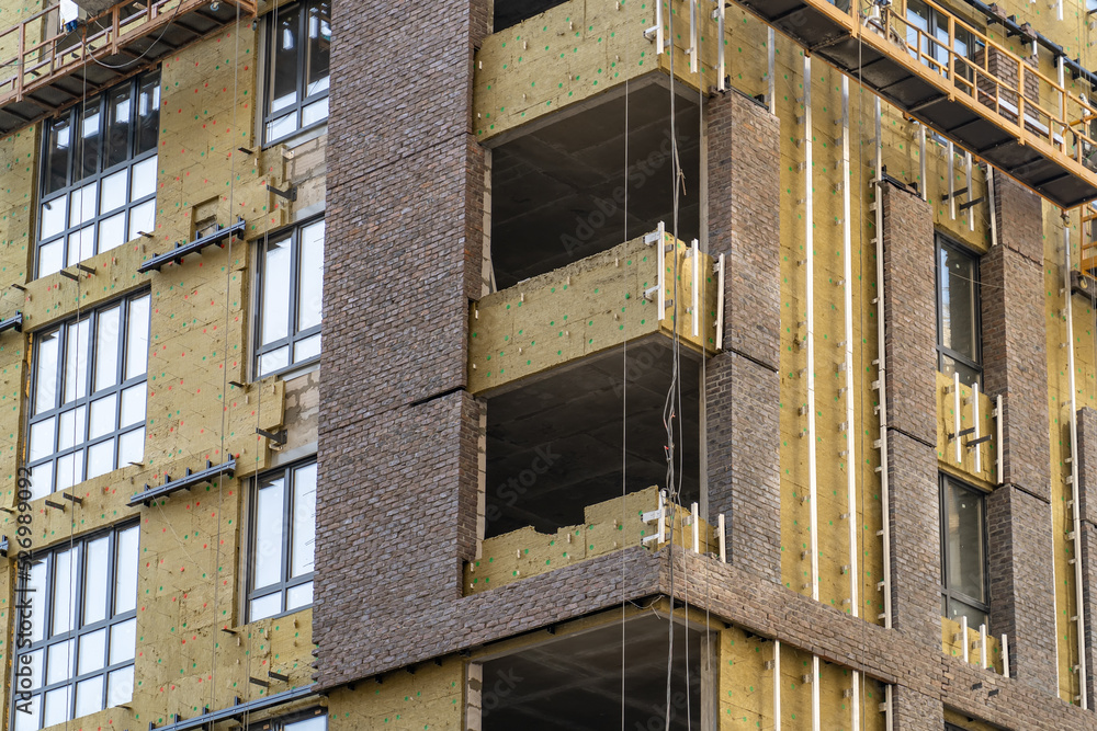 Monolithic concrete frame of apartment building under construction with ...