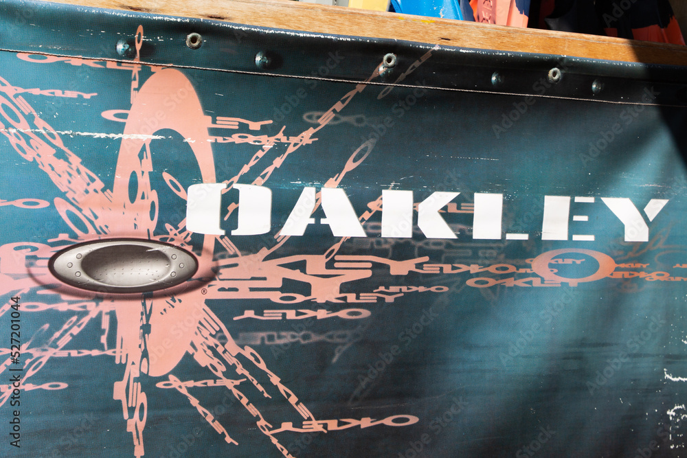 oakley logo sign and surf board brand text on store facade clothing ...