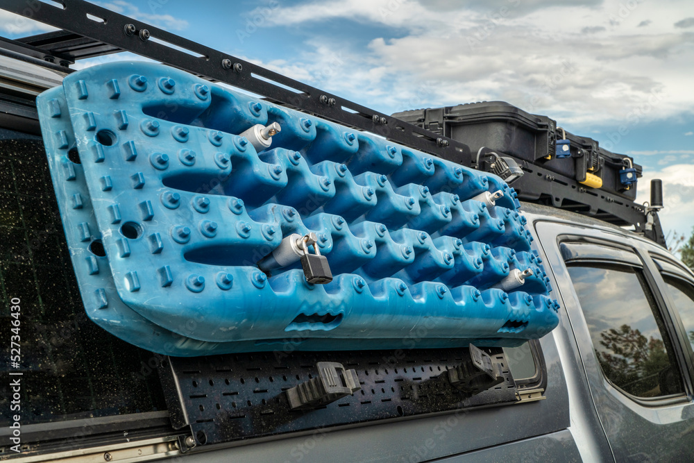 recovery traction ladders mounted on side racks of a truck, used to ...