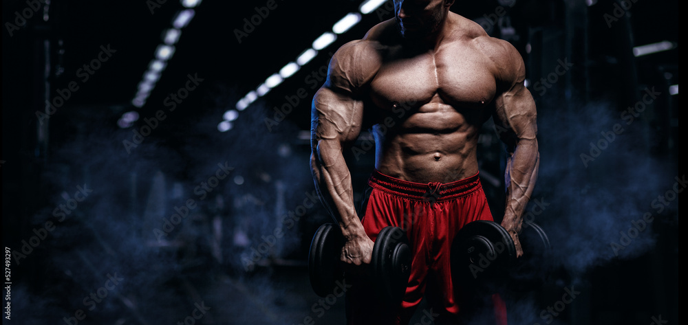 Muscular man bodybuilder training in gym and posing. Fit muscle guy ...