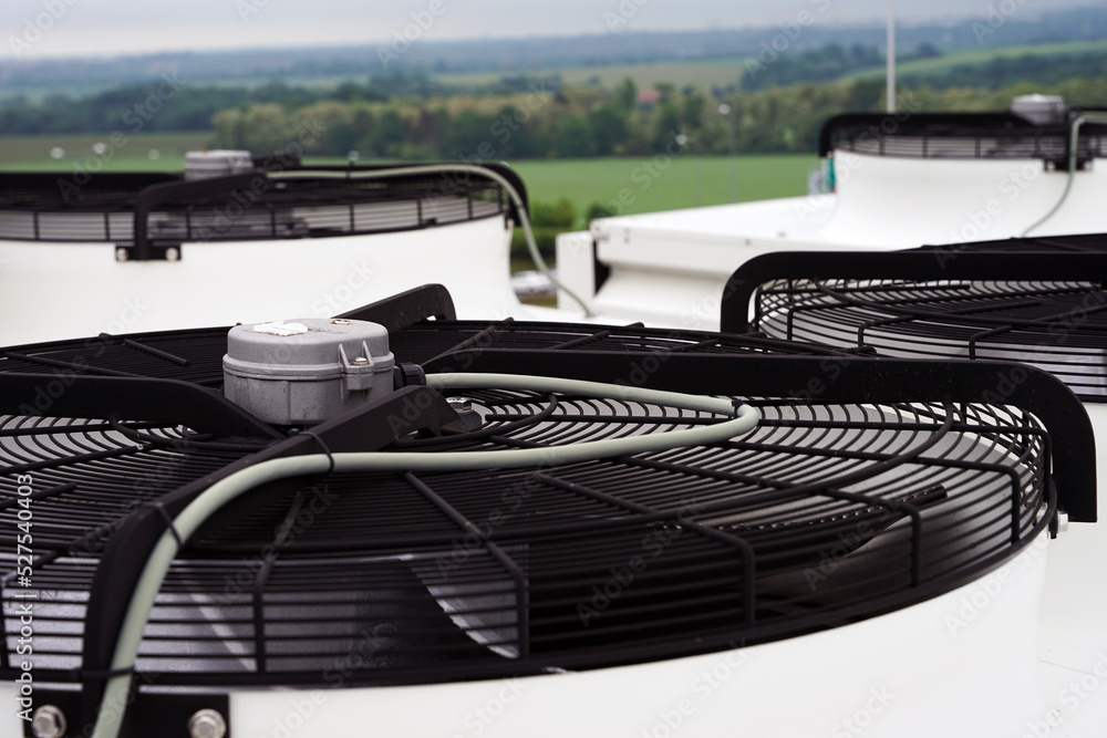 Industrial condenser fans on roof used in air conditioning ...