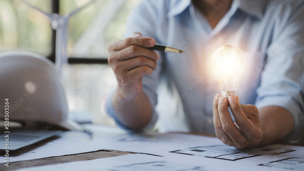 Architects holding light bulbs, Creative new idea. Innovation, finding ...