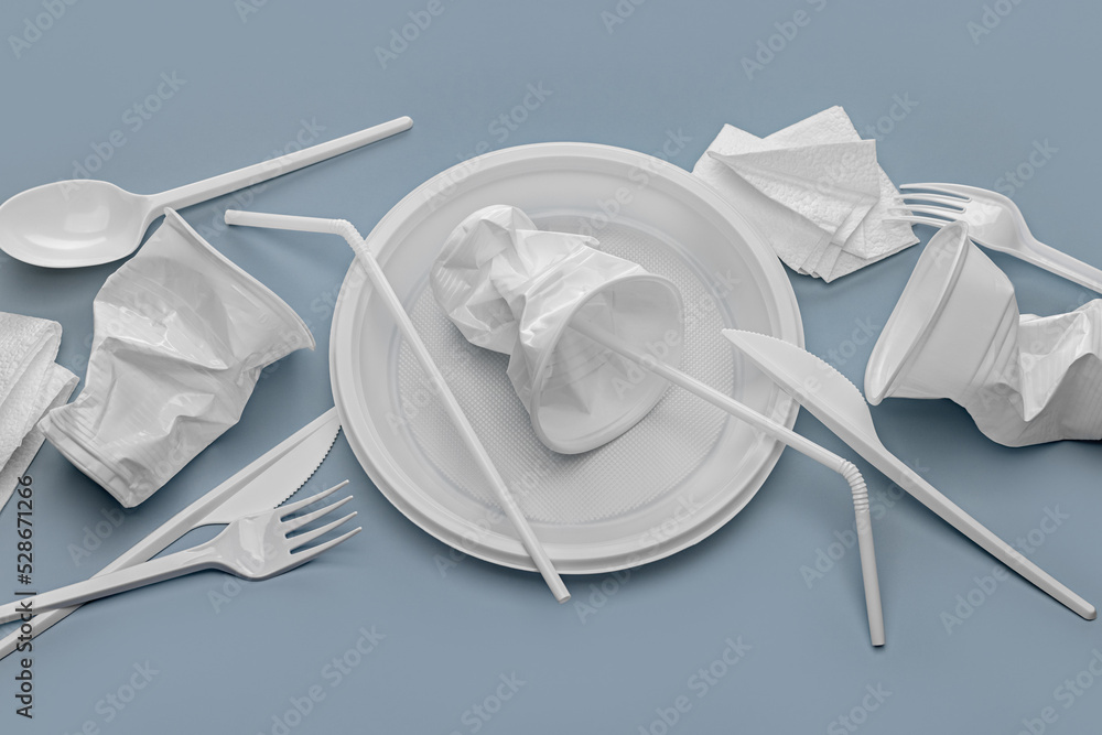 Photo Stock Used white plastic utensils, crumpled disposable cups and ...