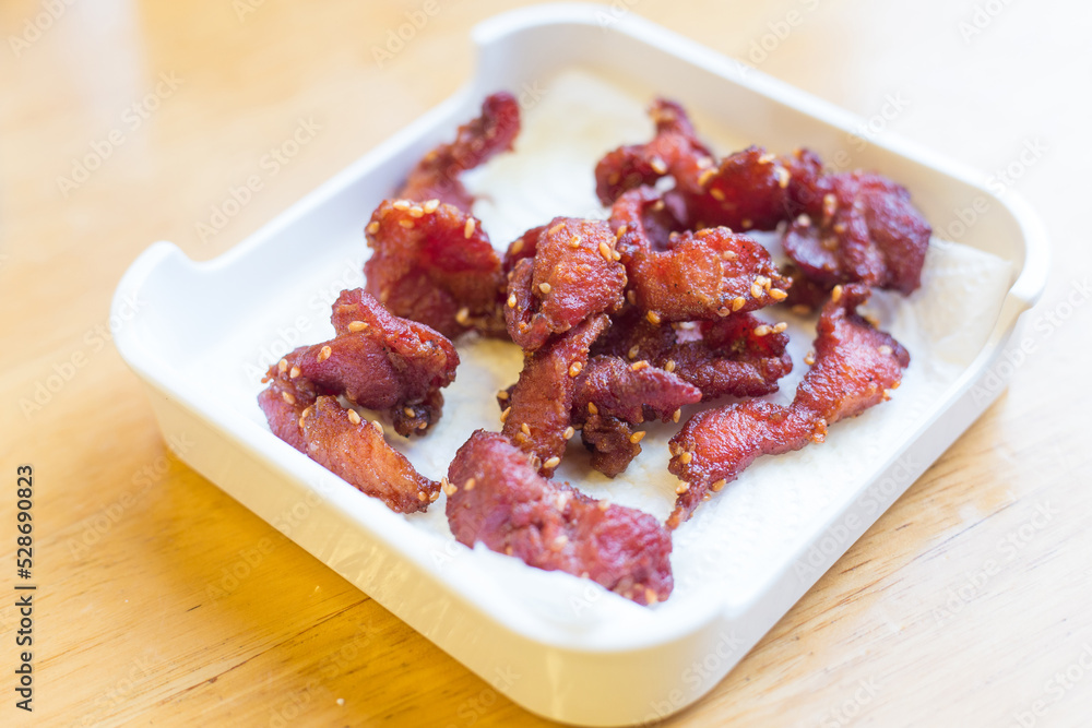 Foto de Stock Deep fried sun dried pork is a appetizer in Thai food. It ...