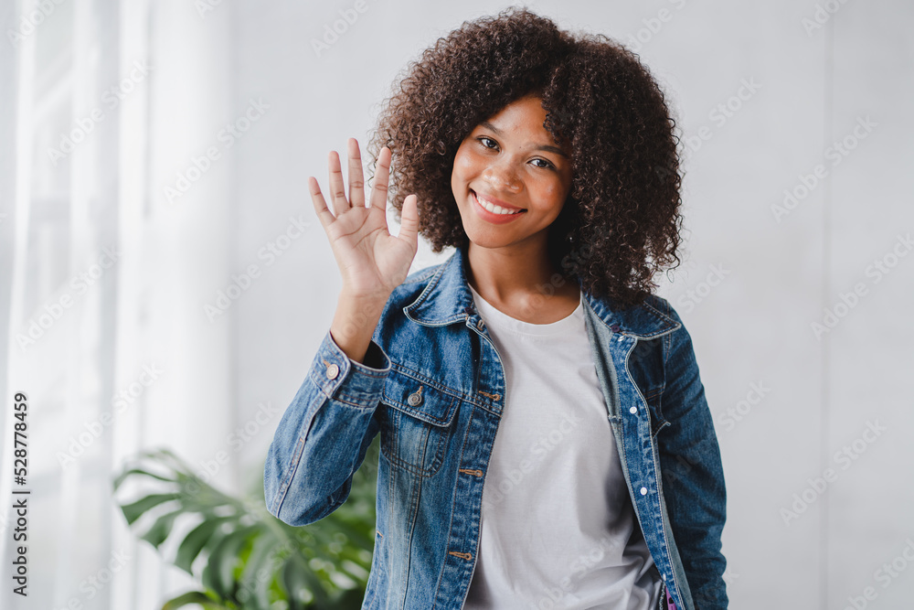 african american woman Video call greetings with friends using laptops ...