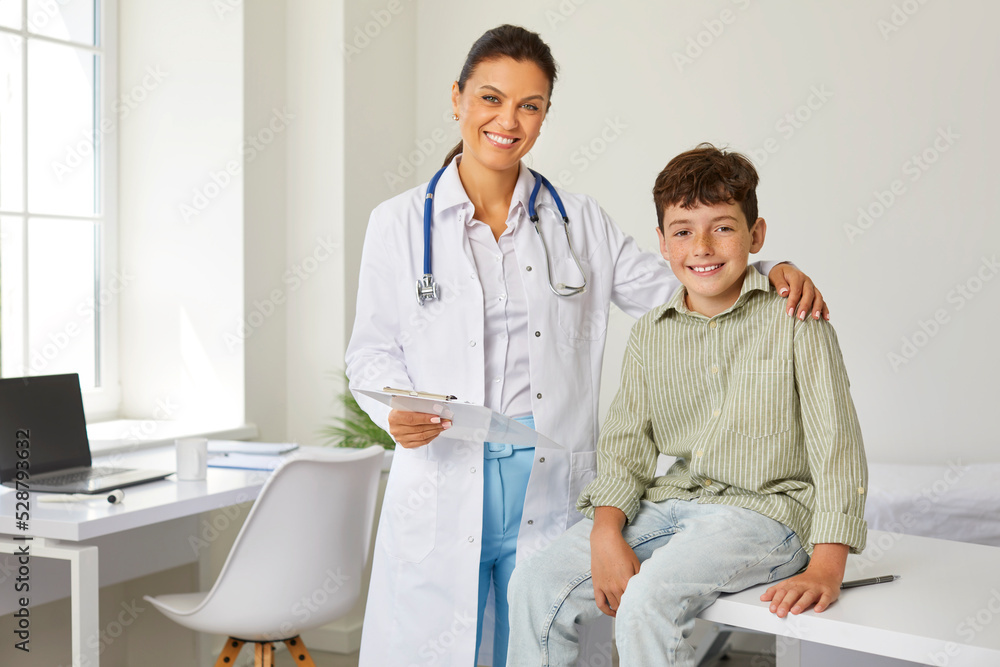 Professional pediatrician doctor woman is cuddling teen boy on ...