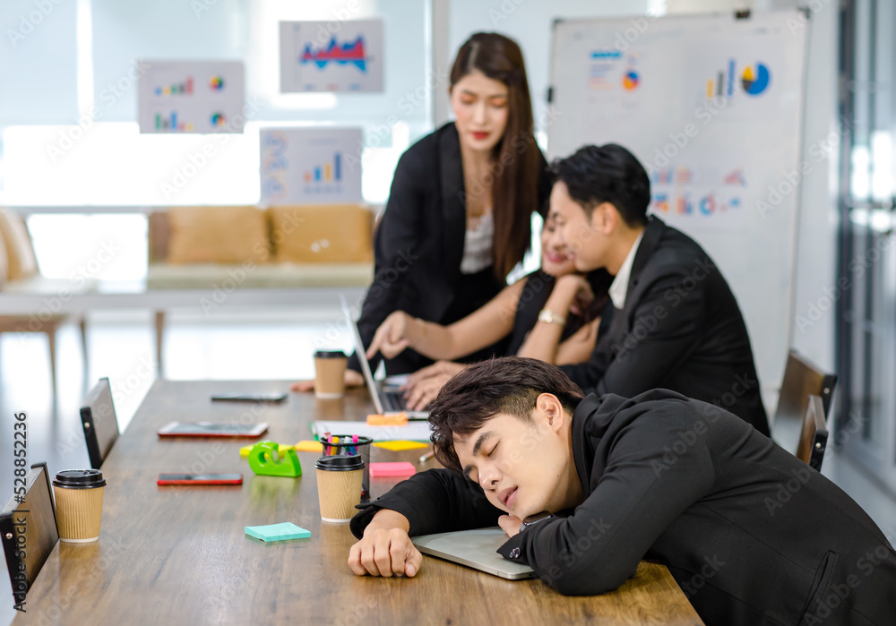 Asian young tired exhausted businesswoman in formal suit sitting ...