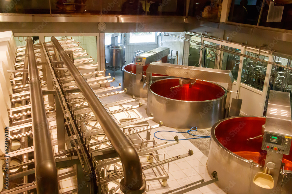Interior of the cheese dairy factory. Equipment at cheese dairy plant ...