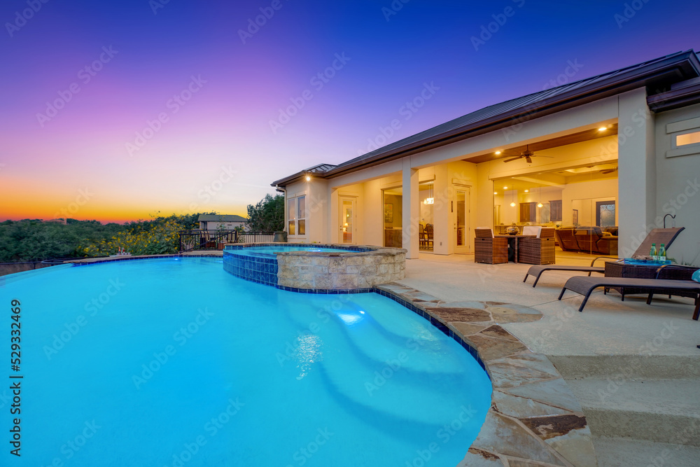a luxury pool at sunset Stock Photo | Adobe Stock