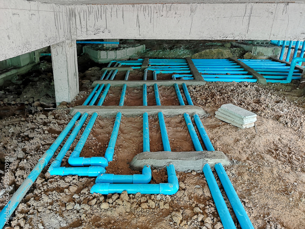 Installation of water pipes in the building. Water pipe system under ...
