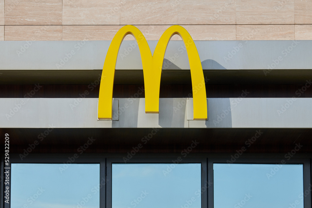 McDonalds logo on fast food restaurant branch, yellow macdonald logo of ...