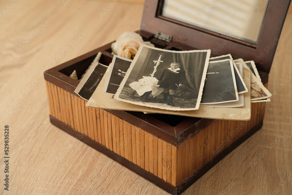 close-up old vintage photos 50s, 60s sepia color in brown wooden box ...
