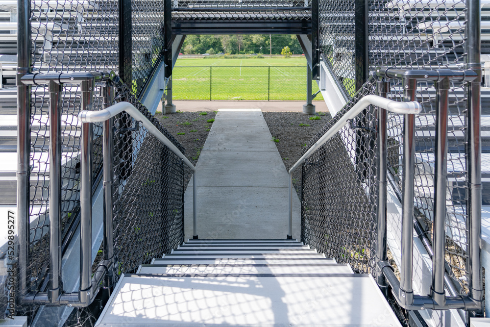 Example of an exit, entrance, vomitorium at empty set of metal stadium ...