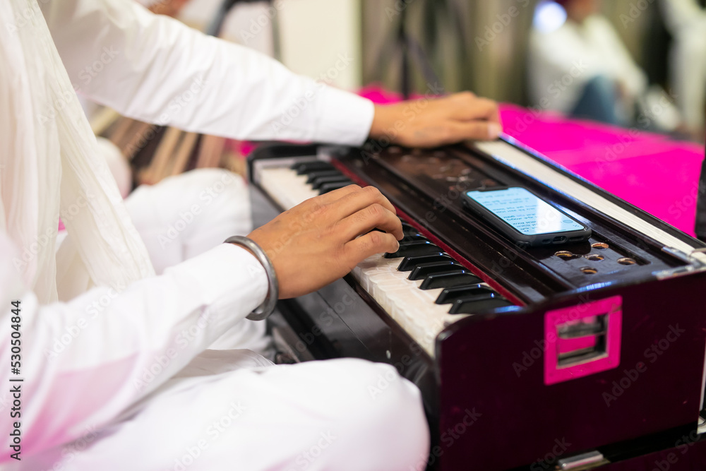 Indian Punjabi Sikh traditional keyboard hands close up Stock Photo ...