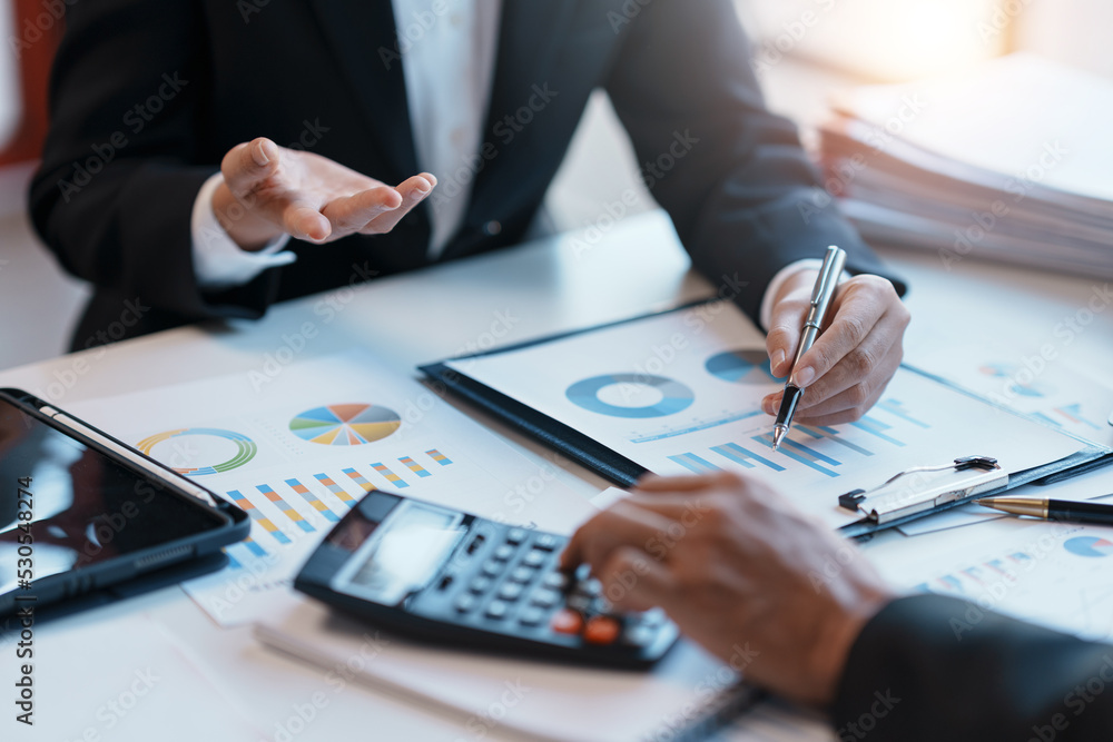 Stock-Foto „Business people meeting and calculating profit and loss The ...