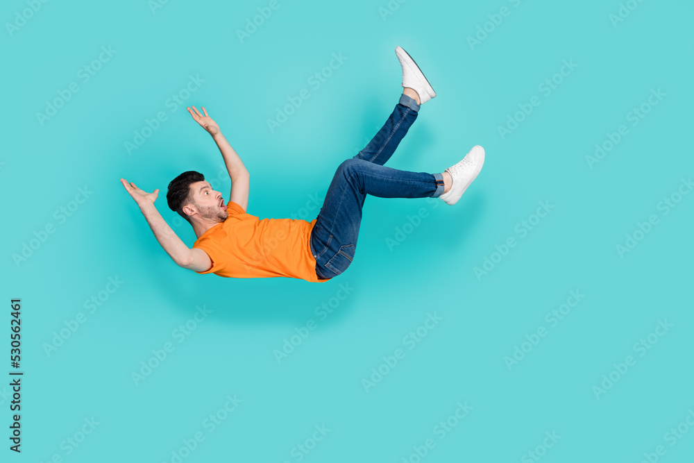 Full size photo of young handsome excited funny man slipped floor ...