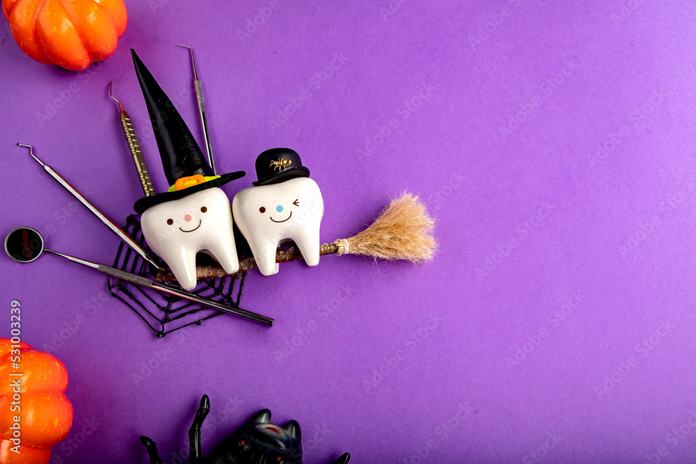 dental concept. figurines of teeth in halloween costumes and dental ...