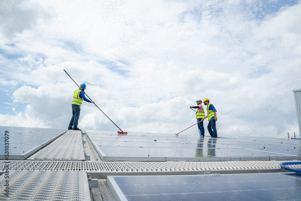 labor working on cleaning solar panel at solar power plant,Professional ...