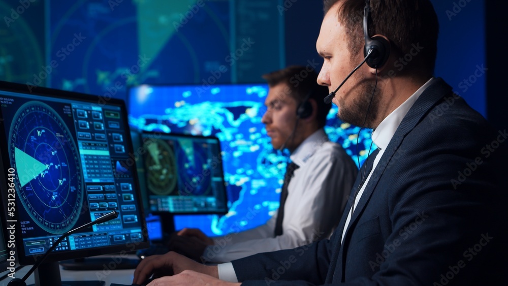 Workplace of the air traffic controllers in the control tower. Team of ...