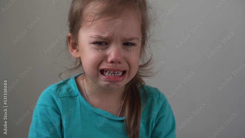 Portrait little girl sad upset child burst into tears cries sob looking ...