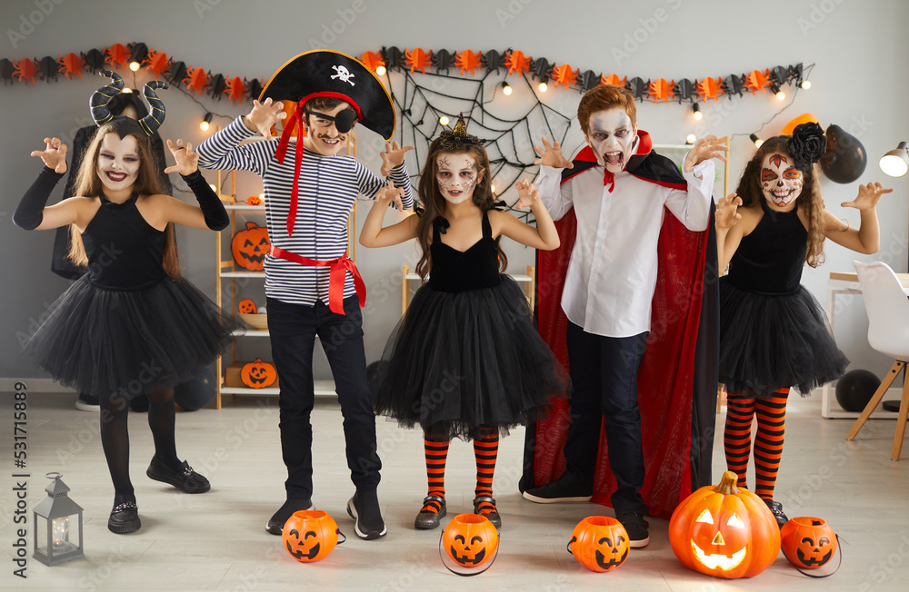 Bunch Of Kids In Different Costumes Having Fun At Halloween Party