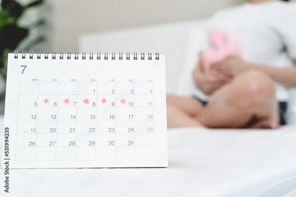 Monthly menstruation symptom period concept. Close up calendar marking ...