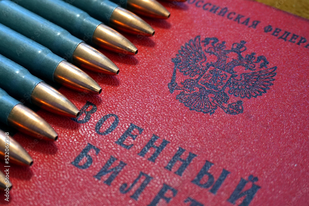 Russian military ID and AK-47 bullets in caliber 7.62x39mm Stock Photo ...
