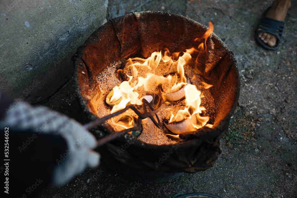 Craftsman during firing ceramics Stock Photo | Adobe Stock