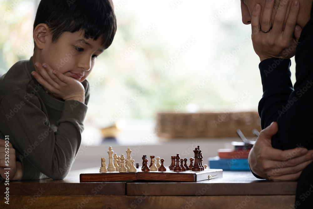 Little kid playing chess Stock Photo | Adobe Stock