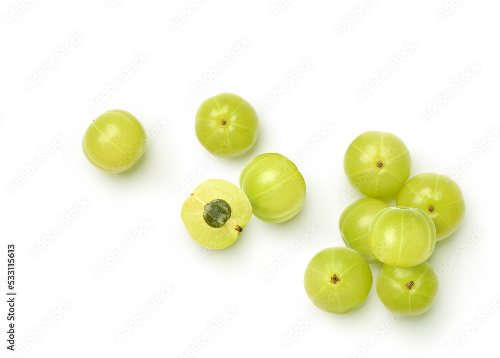 Flat lay (top view) of Fresh Indian gooseberry fruits with cut in half ...