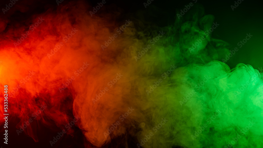 Red green smoke on a black background. Stock Photo | Adobe Stock